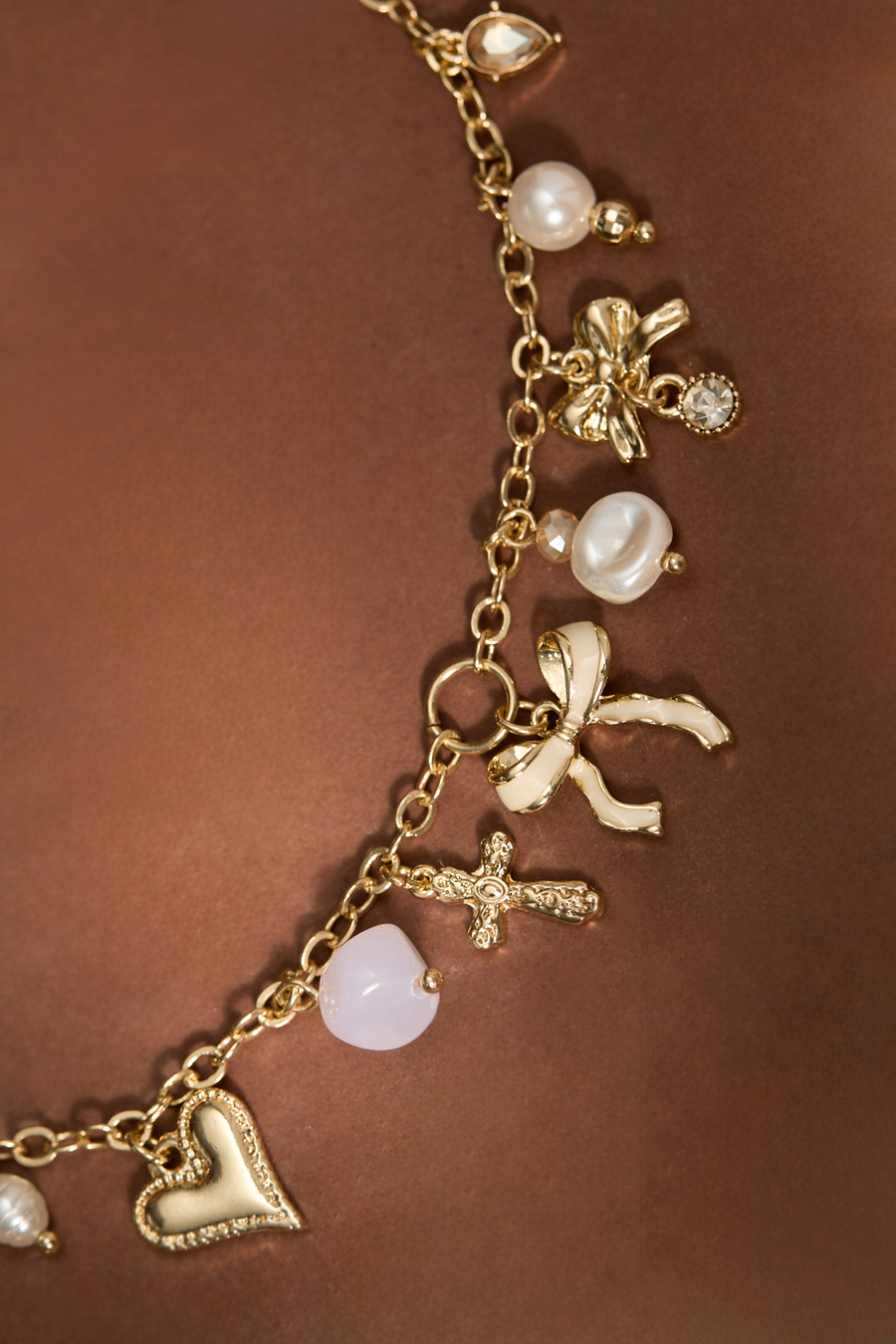 Blessed Bows Charm Necklace in Ivory & Gold | Altar'd State
