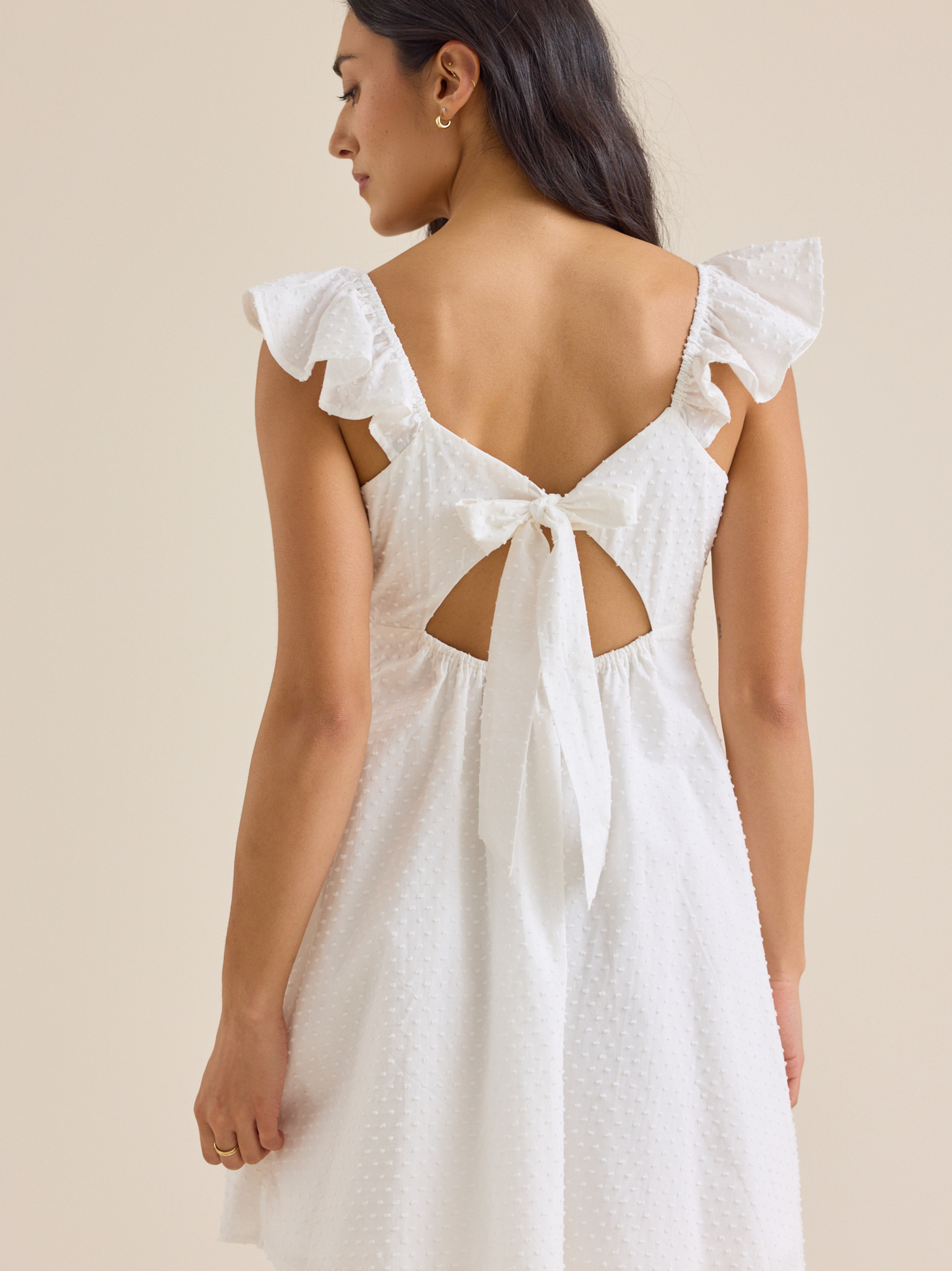 Kristin Clip Dot Mini Dress in White | Altar'd State